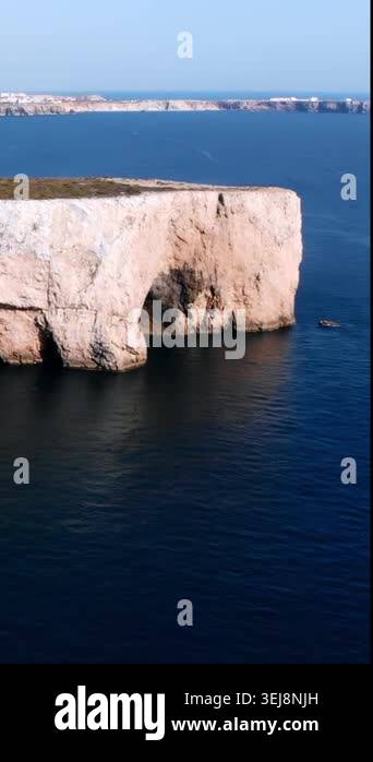 Aerial Limestone Cliff Towering Over Sea, Sheer Pale Rock Face With ...