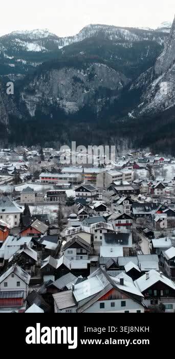 Valley Town Cradled By Towering Cliffs With Snowrimmed Peaks, Broad ...