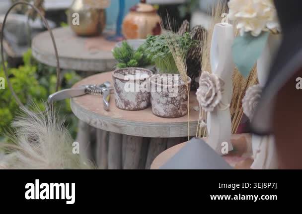 People explore a market filled with plants and crafts on display Stock ...
