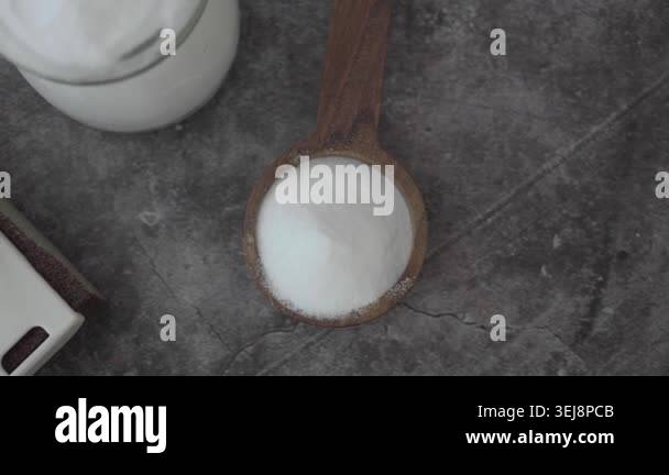 top view of baking soda powder on a black background for cleaning Stock ...