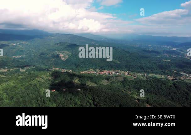Expansive mountain vista with horizon, broad green ridges and distant ...