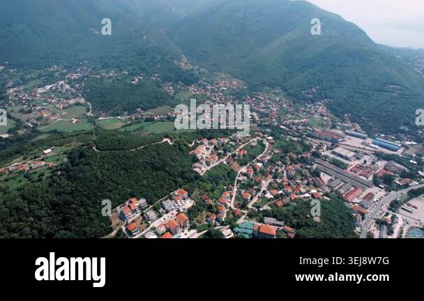 Aerial approach montenegrin valley town industrial, sweeping view of ...