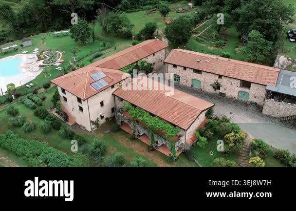 Aerial panorama of boutique retreat estate with historic stone ...