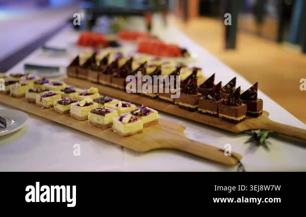 Corporate dessert platter on buffet table, rows of chocolate mousse ...