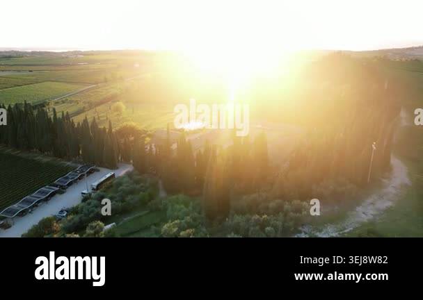 Golden sunset aerial view over villa, cinematic drone glide across ...