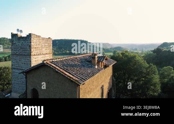 Rooftop tower overlooking rolling tuscan hills and distant valleys ...