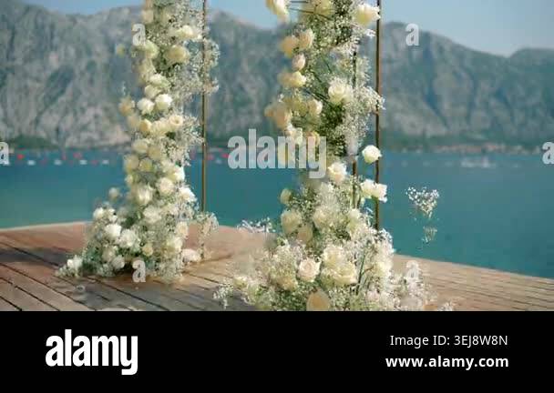 Deck floral base with cascading roses and babys breath anchored on ...