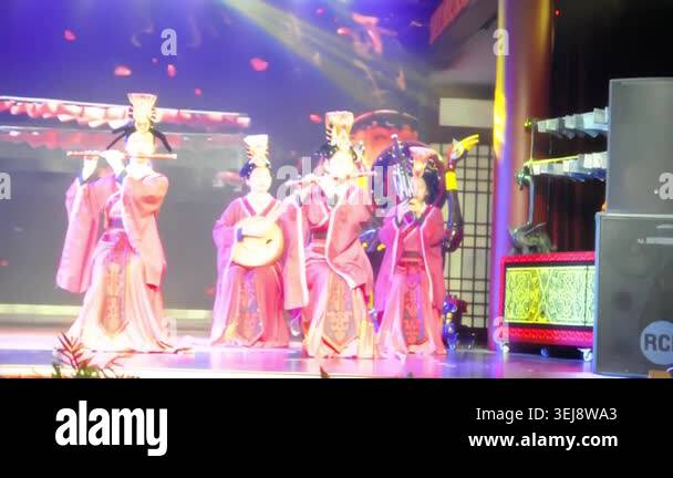 China, Wuhan - March 10, 2019: Artists playing on flute and traditional ...