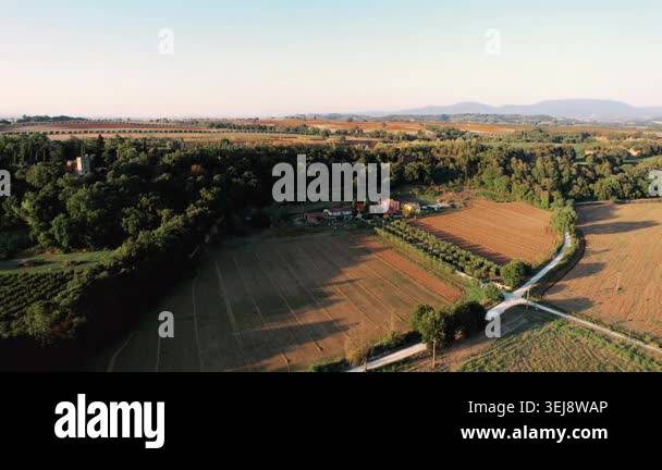 Aerial patchwork fields rural lane farmhouses in italy, varied crop ...