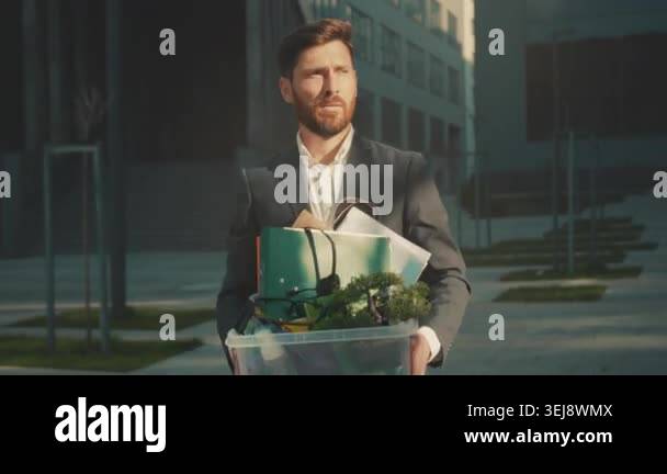 caucasian manager walking out of corporate campus, steady pace holding ...