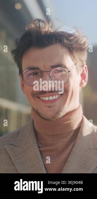 caucasian man smiling candid outdoors in urban setting, approachable ...
