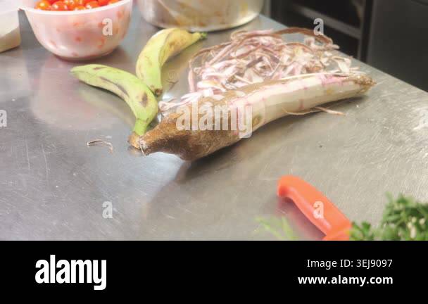 A skilled chef meticulously prepares fresh ingredients, including ...