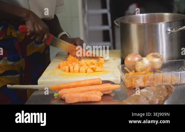A skilled chef in a professional kitchen meticulously prepares ...