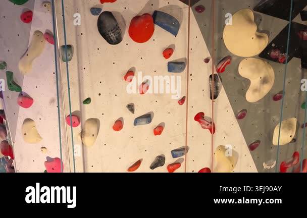Indoor climbing wall with colorful holds full frame sport background ...