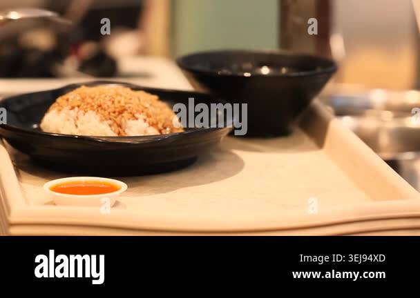Rice with soy sauce served on plate at food court closeup. High quality ...