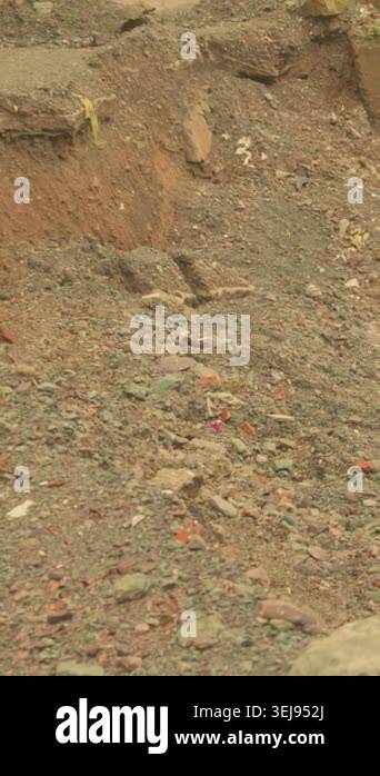Mountain road destroyed by landslide mud flow and debris closeup. High ...