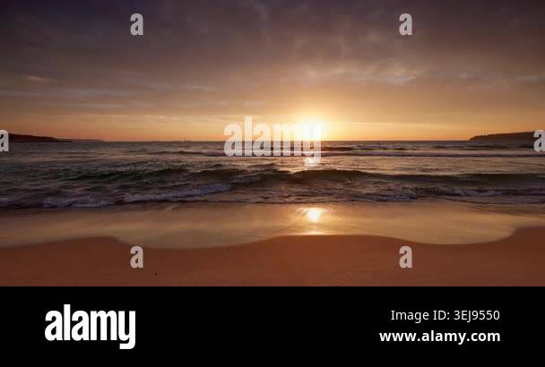 Golden sunrise over sea horizon and sandy tropical beach scenic ...