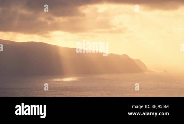 Golden sun rays over ocean cliffs in Madeira island Portugal Dramatic ...