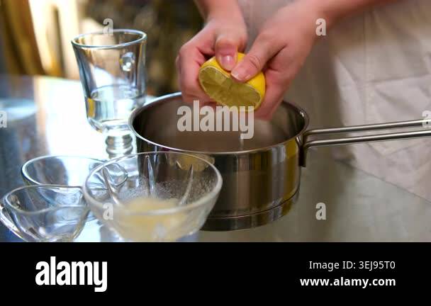 preparing the glaze for Easter from gelatin, whisk, heat hands woman in ...