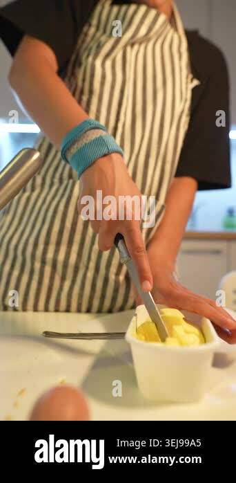 Adding butter cubes into crumb bowl artisan baker folding butter into ...