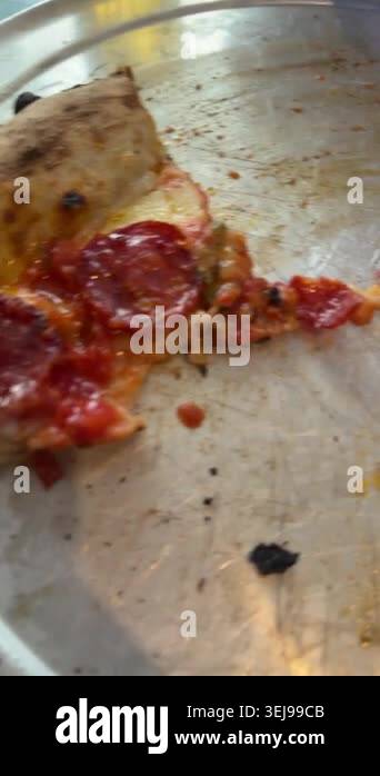 Closeup pepperoni slice metal pan, mushroom and melted cheese, oily ...