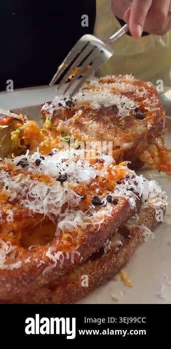 Closeup rustic parmesan toast with grated cheese, golden edges, olive ...