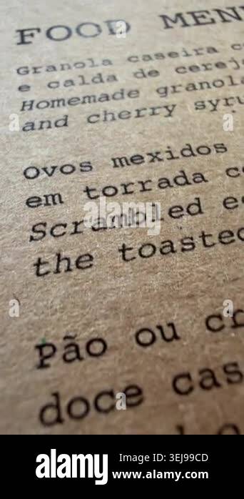 Closeup multilingual menu print on kraft paper with visible kimchi and ...