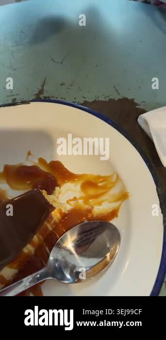 White girl scraping caramel with spoon, enamel plate smear, playful ...