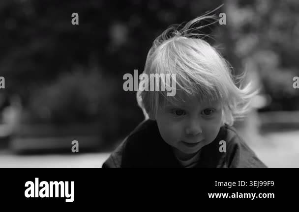 Youthful youngster embracing lively outdoor fun. Child enthusiastically ...
