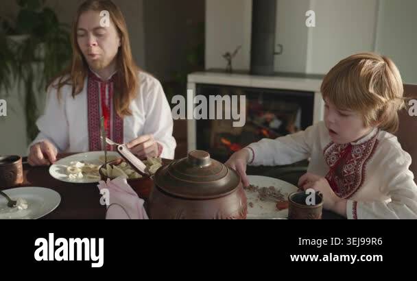 Man With Kid Boy Eat Food Lunch Dinner. Family in Ukrainian Traditional ...