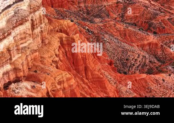 Detail of layered red and white sedimentary rock cliffs. Close-up of ...