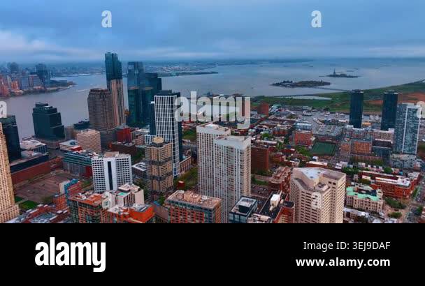 High-rises of Jersey City, New Jersey, USA from drone. Grey waterscape ...