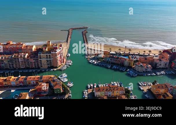Entrance of Port Saplaya harbor with sandy beach. Aerial view of ...