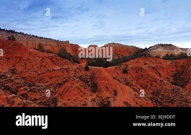 Red eroded hills with green pine trees in Aragon Spain. Landscape of ...