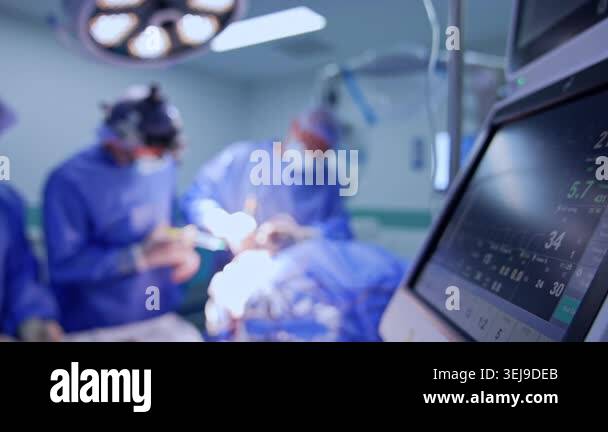Footage near the screen of lung ventilating machine. Medical team works ...