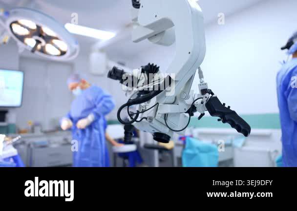Modern technological microscope in the surgery room. Medics are getting ...