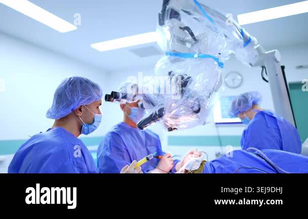 Modern neurosurgical operation in progress. Medical team performs ...