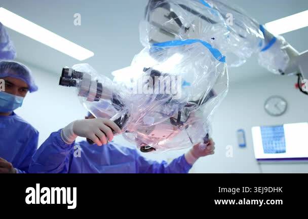High-precision microscope covered with plastic for sterility set over ...