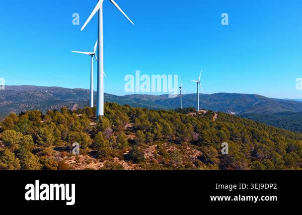 Alicante, Spain, 8 August 2025: Wind turbines above pine forests in ...