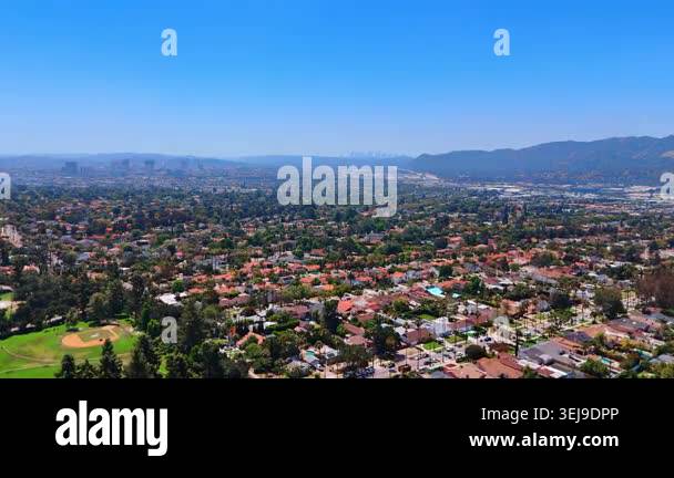 Vast plain with dense low-rise residential area. Silhouettes of ...