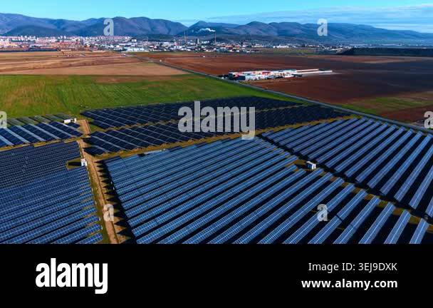 Descending over the huge field of solar panels. Large agricultural ...