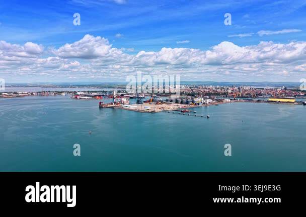 Footage over vast marina with a port facility on. Modern cityscape ...