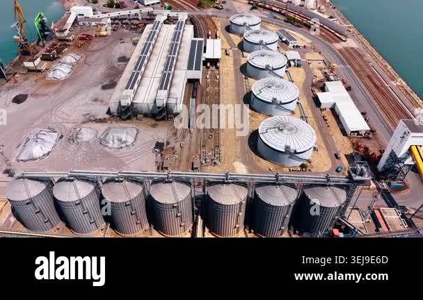 Huge tanks of diverse size at the territory of the modern port. Large ...