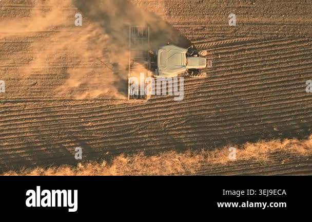 Aerial View of Tractor Plowing Brown Soil in Agricultural Field ...