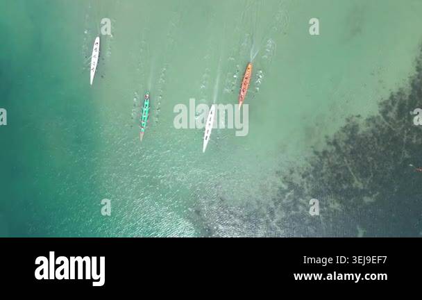 Top Down Aerial View of Rowing Boats Competing in a Race on Turquoise ...