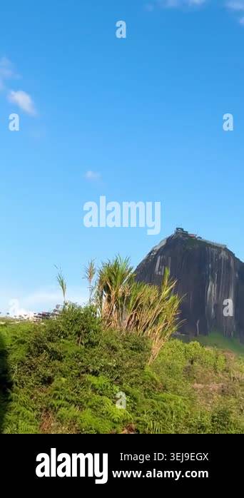 Vertical panoramic video of Guatape reservoir revealing Peol rock from ...