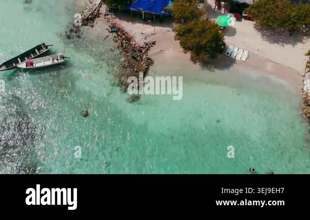 Drone overhead shot of Isla Mucura beach with crystal clear turquoise ...