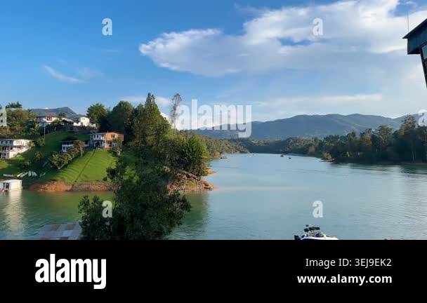 Horizontal wide angle video of Guatape reservoir showing shoreline ...