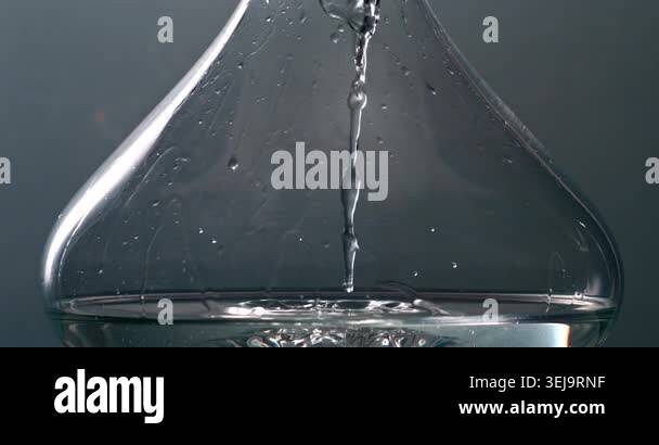 Water Drops Falling Into Transparent Liquid Macro Close Up Slow Motion ...