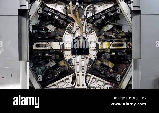 Front view of a complex automated industrial printing press machine ...
